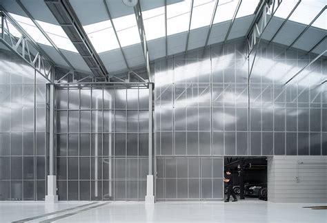 Archive Auto By Phtaa Unfolds Angled Mesh Panel Facade In Bangkok