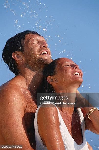 Caucasian Couple Taking Shower Together Outdoors Photos And Premium High Res Pictures Getty Images
