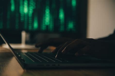 premium photo hacker code in laptop cyber security privacy or hack