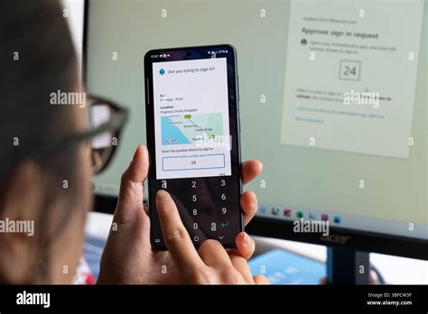 A Woman Working From Home Entering A Number On The Microsoft