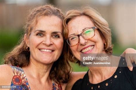 Smiling Happy Mature Lesbian Couple Posing Looking At The Camera High