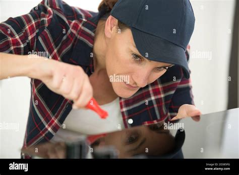 Woman Screwing Down A Screw Stock Photo Alamy
