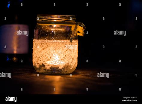 Macro Night Shot Of A Decorated Jar With Lit Candle Burning With Soft