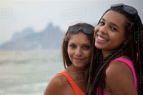 Portrait Of Two Smiling Young Women On Ipanema Beach Rio De Janeiro