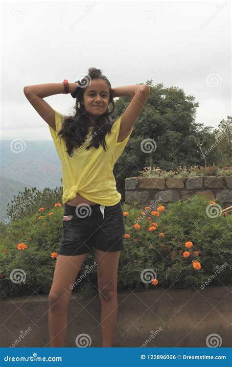 Indian Young Girl Posing In Style At A Hill Station On Holiday Stock