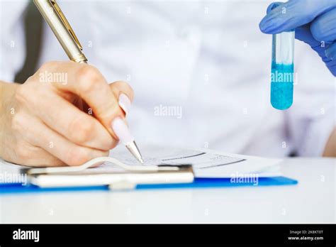 Medicine Lab Technician Doing Chemistry Experiment Close Up Of Scientist Checking Test Tube In