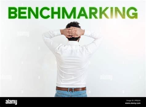 Hand Writing Sign Benchmarking Business Idea Evaluate Something By