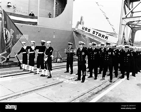The Ships Color Guard And Crew Stand At Parade Rest During The