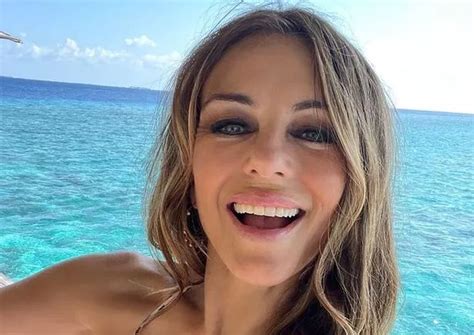 Elizabeth Hurley 58 Stuns In Alluring Pink Swimsuit For Fashion