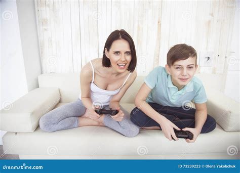 Mother And Her Adult Son Playing On Console Stock Image Image Of