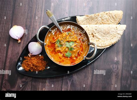 Traditional Sev Bhaji Or Sev Tamatar Nu Shaak With Jowar Bhakri Sev Is A Crisp Fried Gram Flour