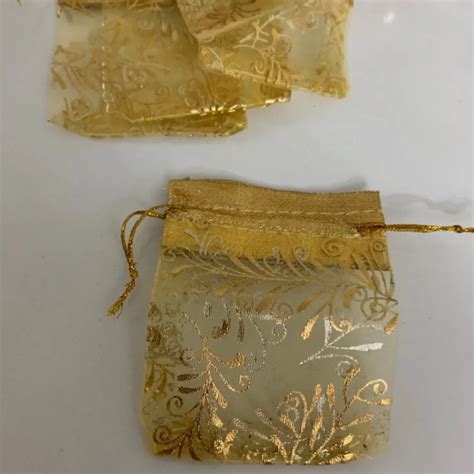کمدا قیمت و خرید Bag توری ابعاد کوچک رنگ طلایی