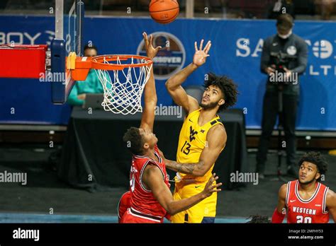 West Virginia Forward Isaiah Cottrell 13 Floats The Ball To The Hoop Over A Western Kentucky