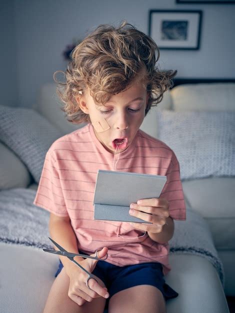 Premium Photo Boy With Mirror Pulling Tooth Out