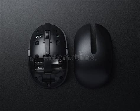 Disassembled Black Computer Mouse On A Black Plastic Background Repair