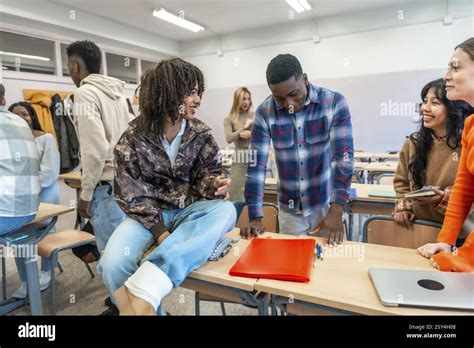 Multi Ethnic University Students Collaborating On A Project Discussing
