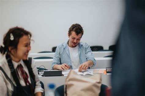 Students Engaged In Classroom Activities With Professor Assistance