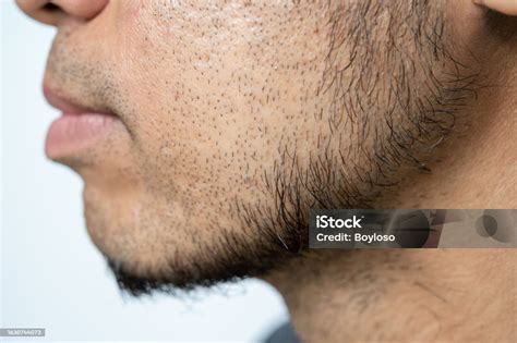 Side View Of Asian Man Face With Beard Grows On His Lower Face Stock