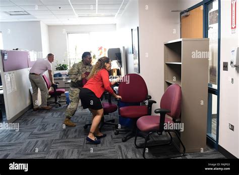 Army Reserve Soldiers And Staff Members Barricade A Main Doorway During