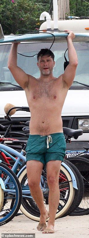 Colin Jost Models His Buff Torso As He Is Seen Surfing Off The Coast In