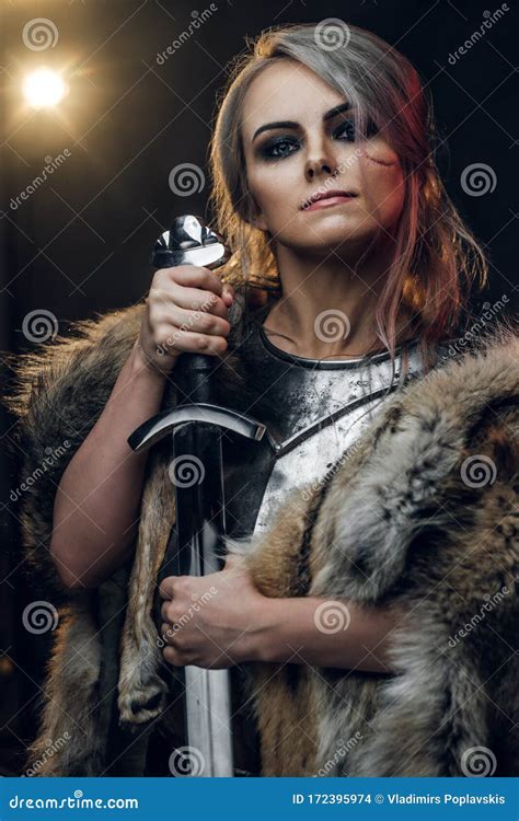 Portrait Of A Beautiful Warrior Woman Holding A Sword Wearing Steel Cuirass And Fur Fantasy