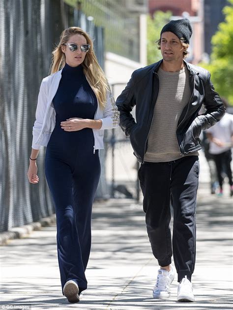 Candice Swanepoel Shows Off Her Bump In Navy Jumpsuit With Fiancé