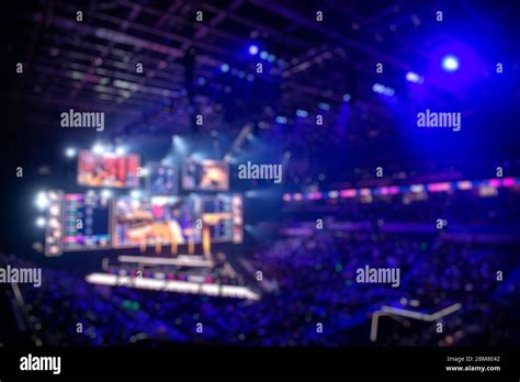 Blurred Background Of An Esports Event Big Illuminated Main Stage Of