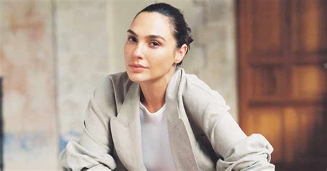 When Gal Gadot Got Comfortable On A Bed With Her Black Ribbed Top And A