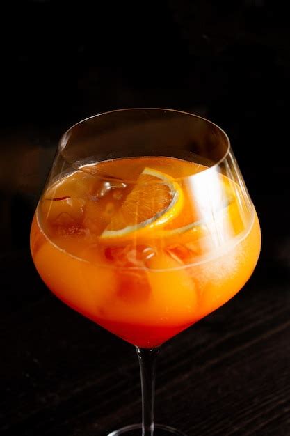 Premium Photo Orange Coctail In A Hight Glass
