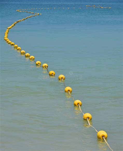 Chain Of Yellow Buoys In Blue Sea Water Stock Image Image Of