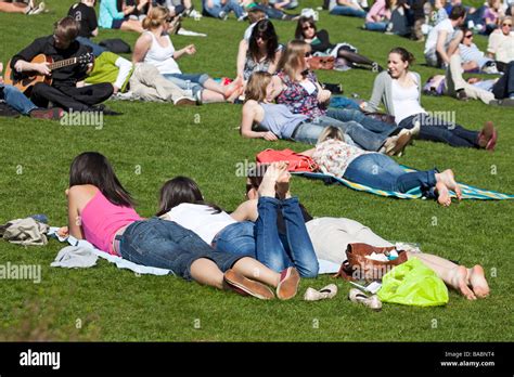 Groups Of Young People Enjoying A Sunny Day In Glasgows Botanic