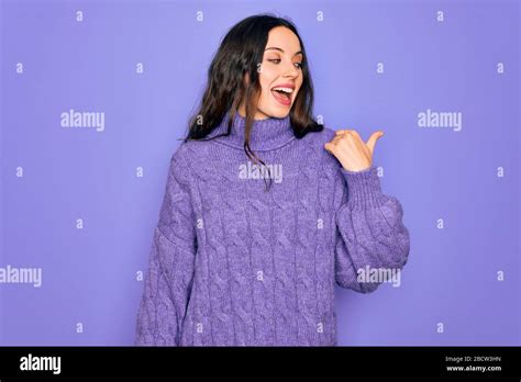 Young Beautiful Woman Wearing Casual Turtleneck Sweater Standing Over
