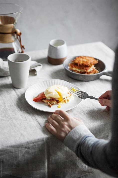 Egg Benedict On A Crispy Hash Brown By Stocksy Contributor Ellie