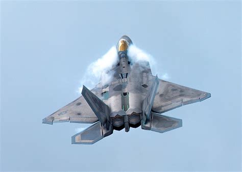 F22 Raptor In A High G Maneuver With Condensation Trails Forming Around