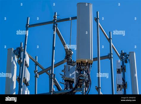 Close Up Of Tower With 6g 5g 4g Cellular Network Antenna On Blue Sky