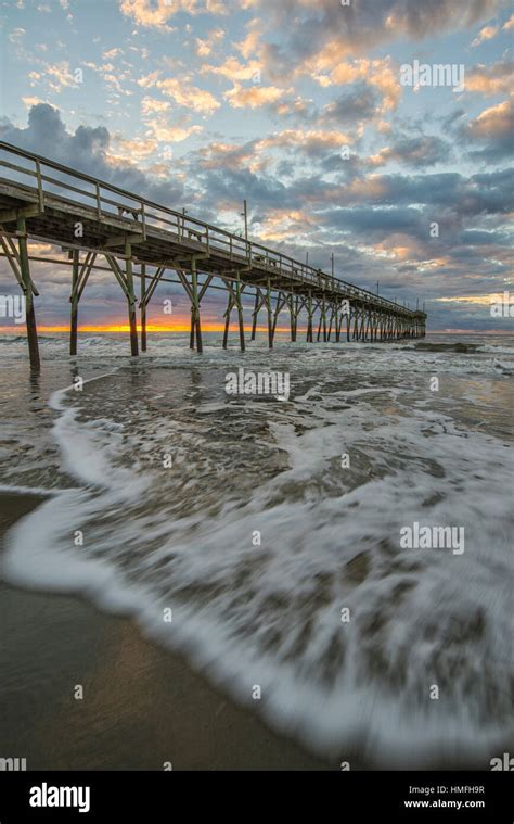 Beach Ocean Waves And Pier At Sunrise Sunset Beach North Carolina
