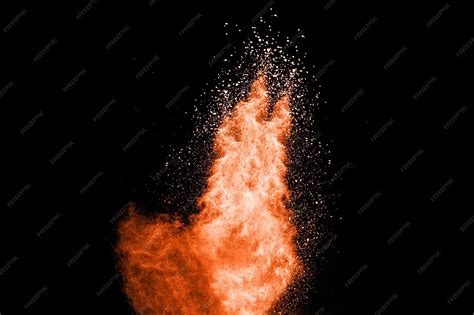 Premium Photo Launched Colorful Orange Dust Particles Splashing