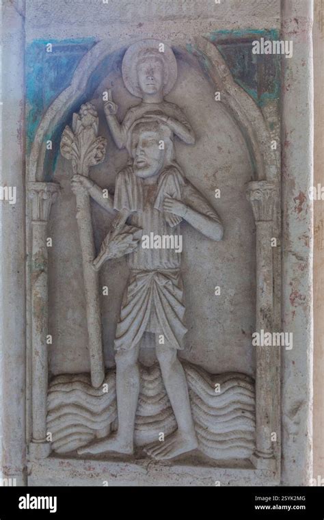 A Stone Relief Depicting The Baptism Of Christ With John The Baptist