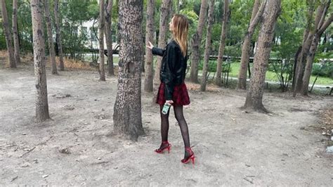 Girl In Black Stockings And High Heeled Sandals Plays With The Sandals And Suddenly Her Heel