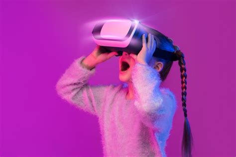 Premium Photo Amazed Preteen Girl Experiencing Vr Headset Game On