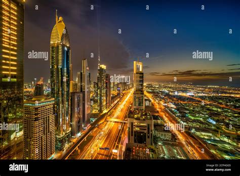 A View Of The City Skyline At Dusk From The Financial District Of