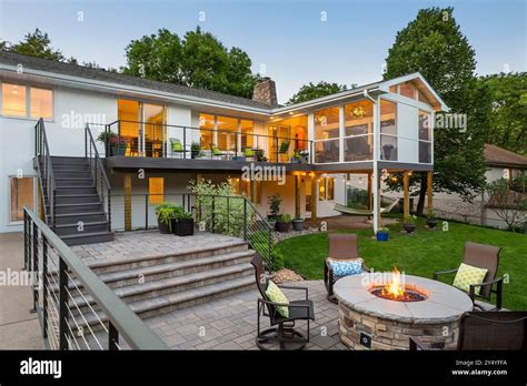 Back Of Split Level House With New Deck Patio And Screened Porch Stock