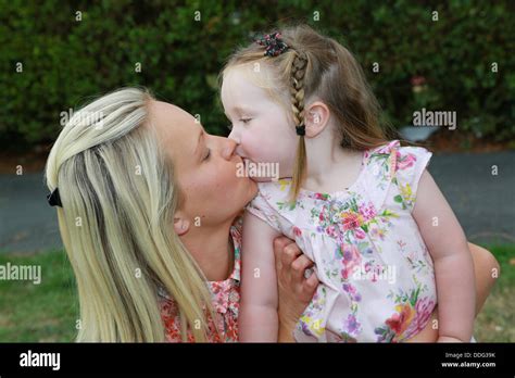 Mother And Daughter Kissing Stock Photo Alamy