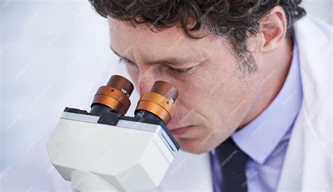 Premium Photo Life Under The Microscope A Scientist Observing