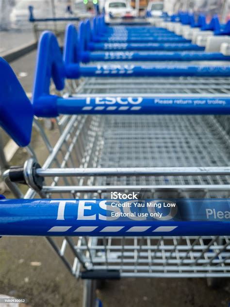 Tesco Supermarket Shopping Trolleys With The Compnays Name And Logo
