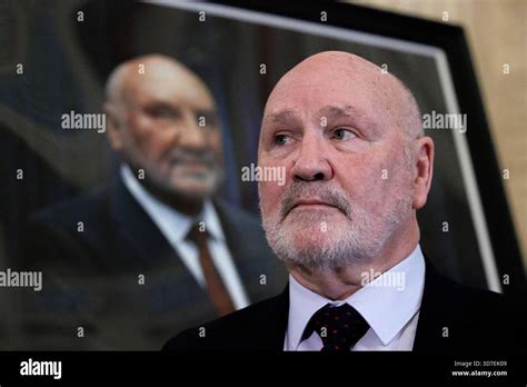 Former Stormont Speaker Alex Maskey In Front Of A Portrait Of Him By