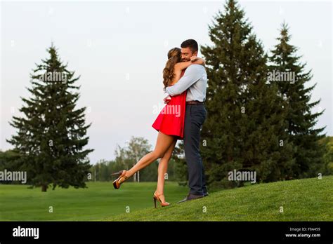 Guy Hugging His Girlfriend Stock Photo Alamy