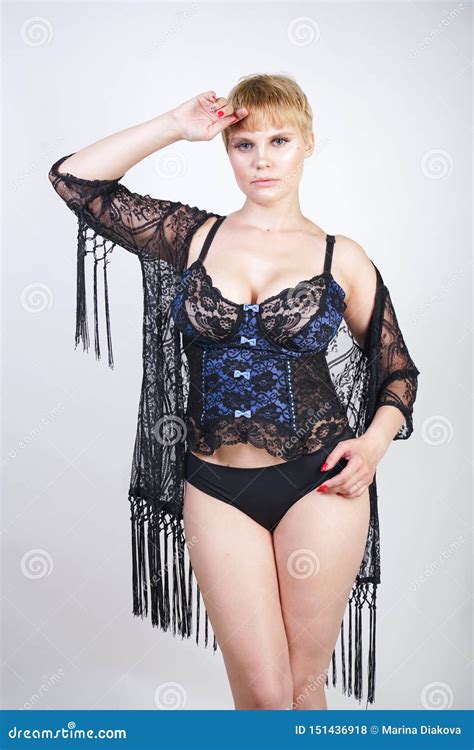 Plus Size Woman With Short Hair In Blue And Black Lace Corset Lingerie