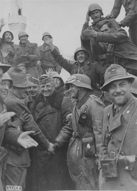 Italian And German Soldiers Meet In A Small Town During The Invasion Of