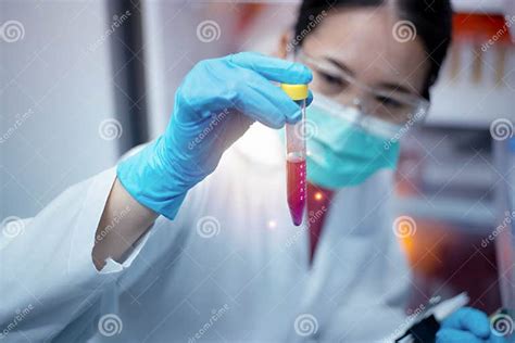 Scientist Woman Show Sample Solution In Test Tube Checking Sample